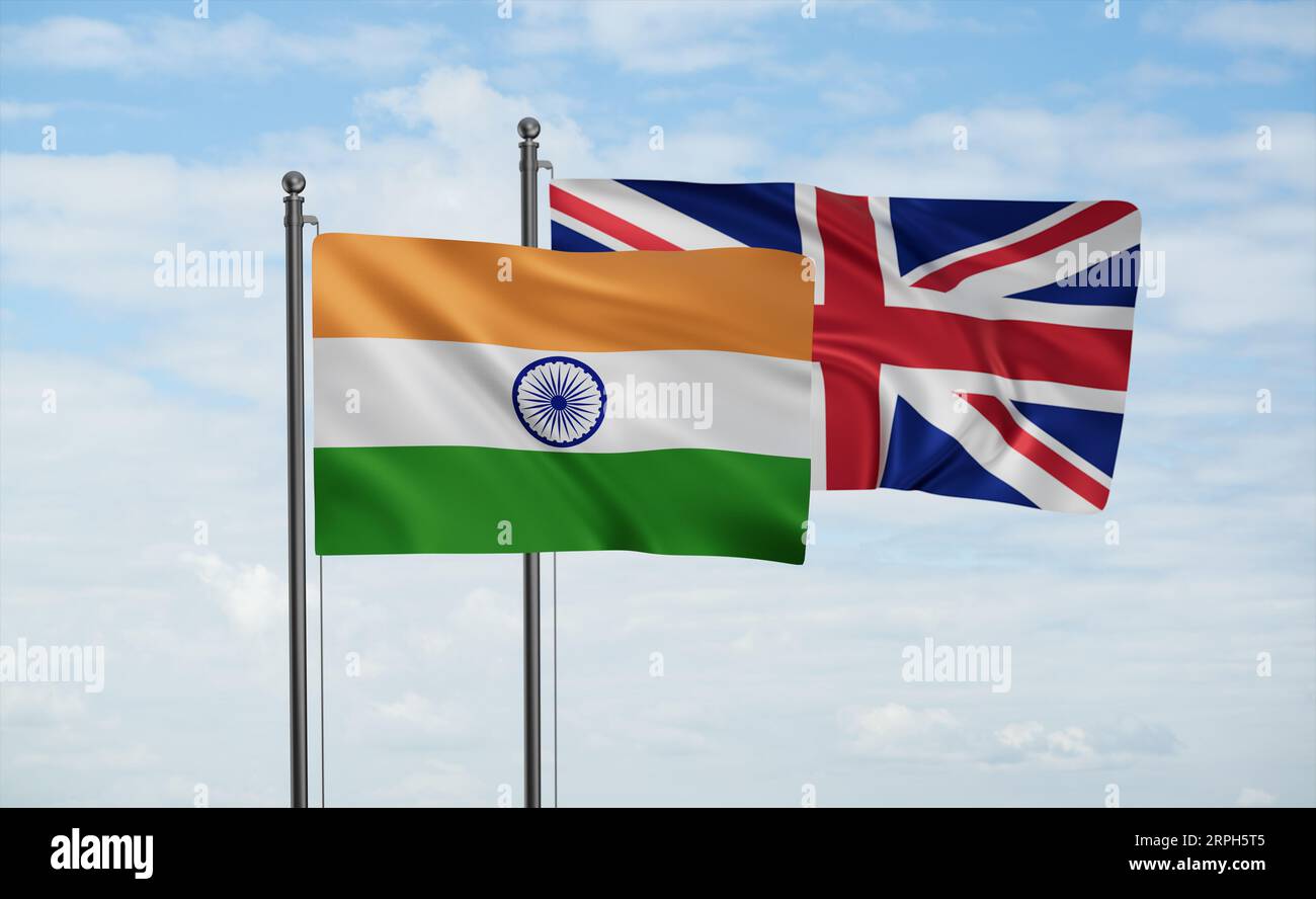 United Kingdom and India flag waving together in the wind on blue sky ...