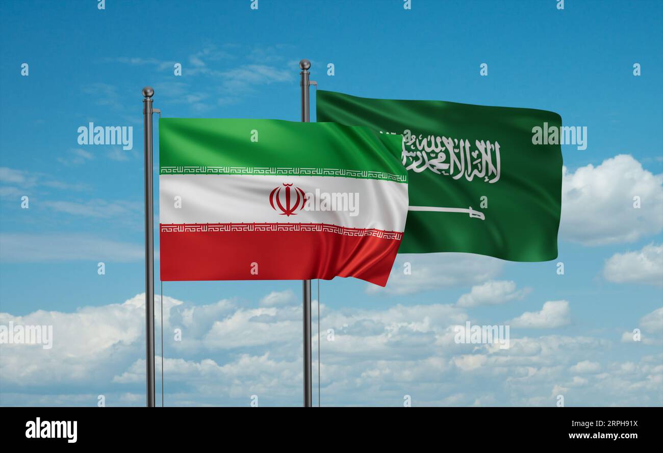 Iran and Saudi Arabia flags waving together in the wind on blue sky ...