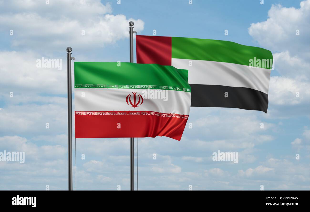United Arab Emirates and Iran flag waving together in the wind on blue ...