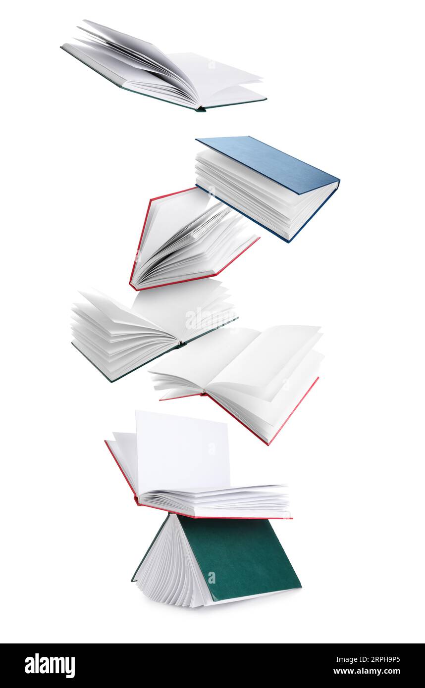 Many flying books on white background Stock Photo - Alamy