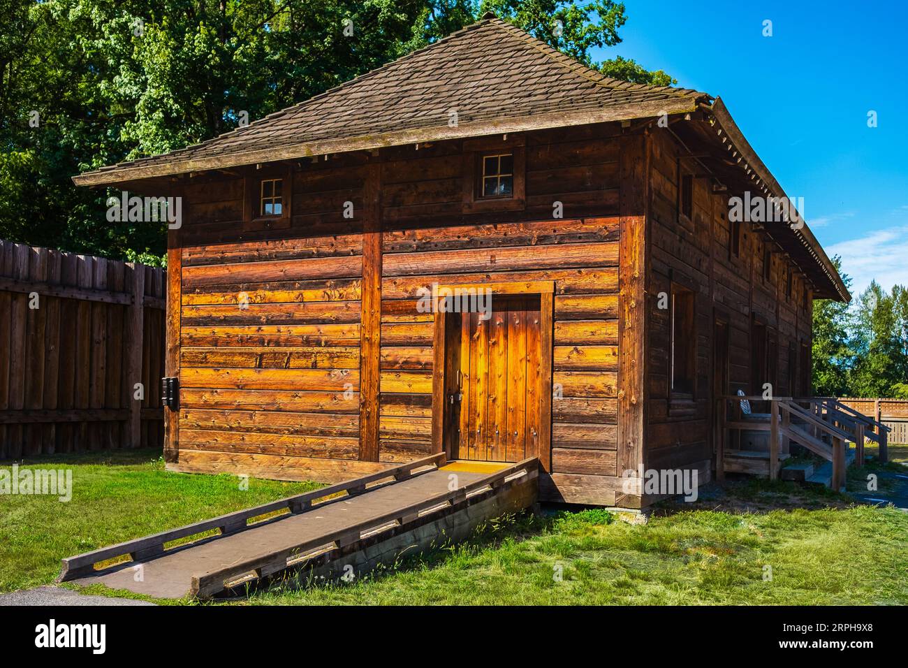 An old traditional rustic wooden house log cabin with a small windows ...