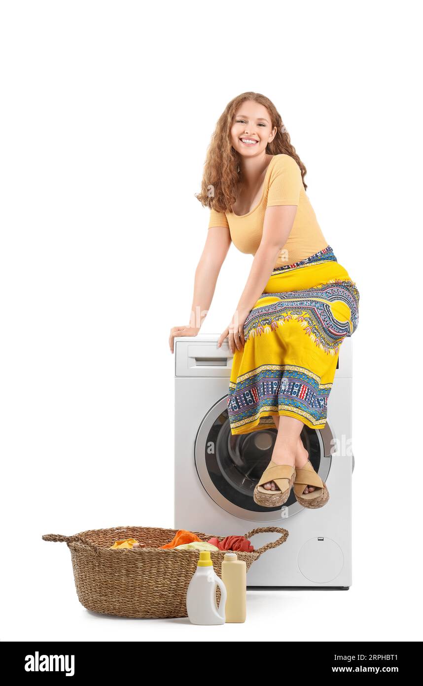 Woman sitting on washing machine hi-res stock photography and images ...