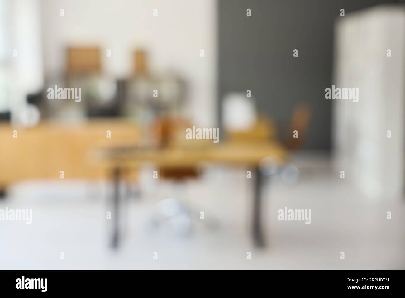 Blurred view of modern office with workplace Stock Photo - Alamy