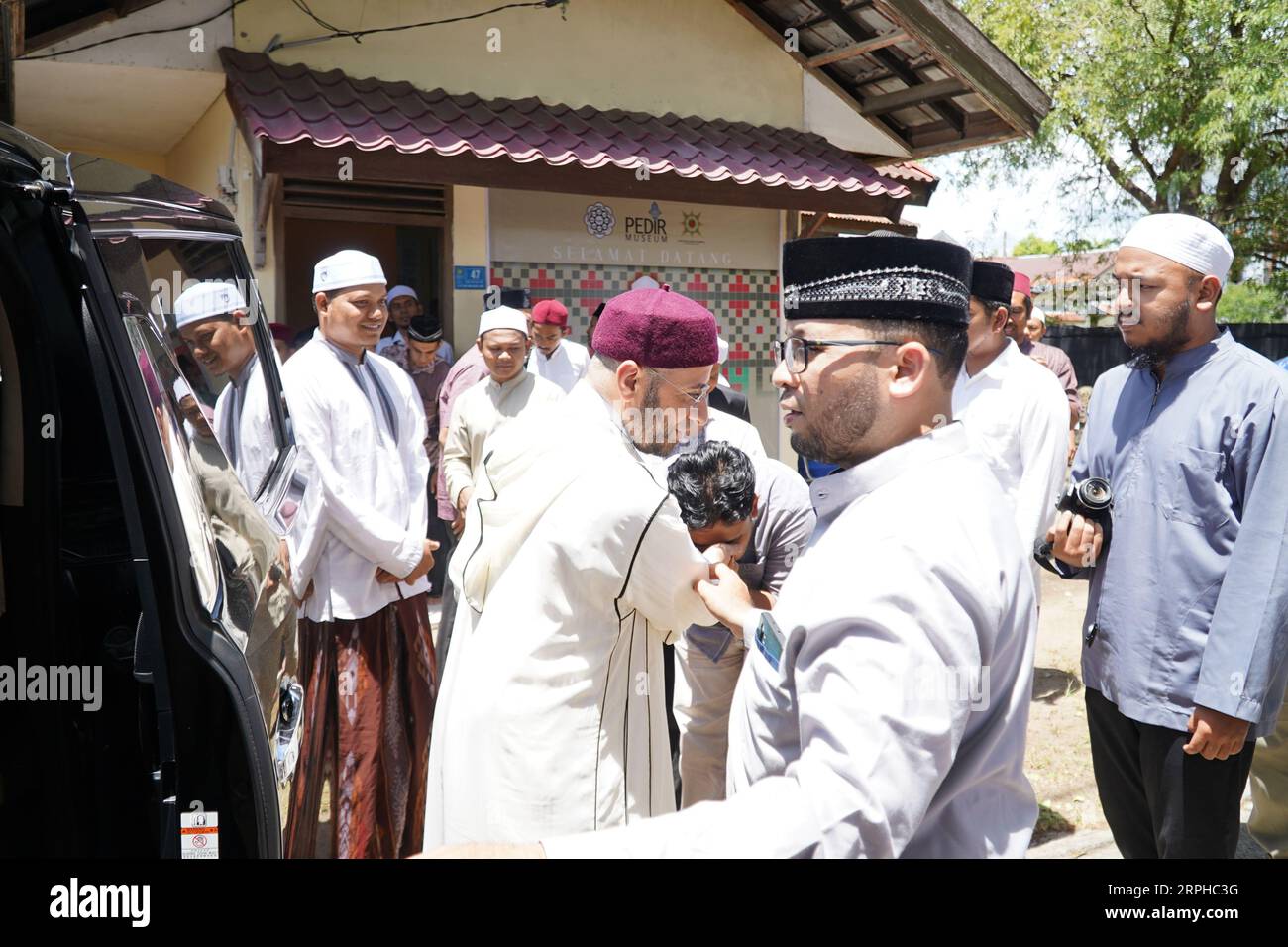 Sheikh Usama Elsayed Alazhary kissed the boy's in Aceh, Indonesia Stock ...