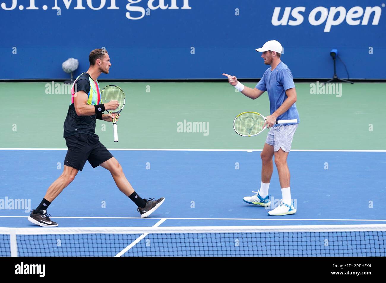 Robert Galloway and Albano Olivetti reacts during a men's doubles match ...
