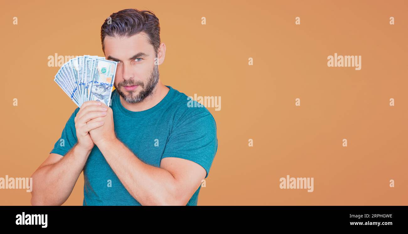 Successful man counting money. Handsome middle age man holding bunch of ...