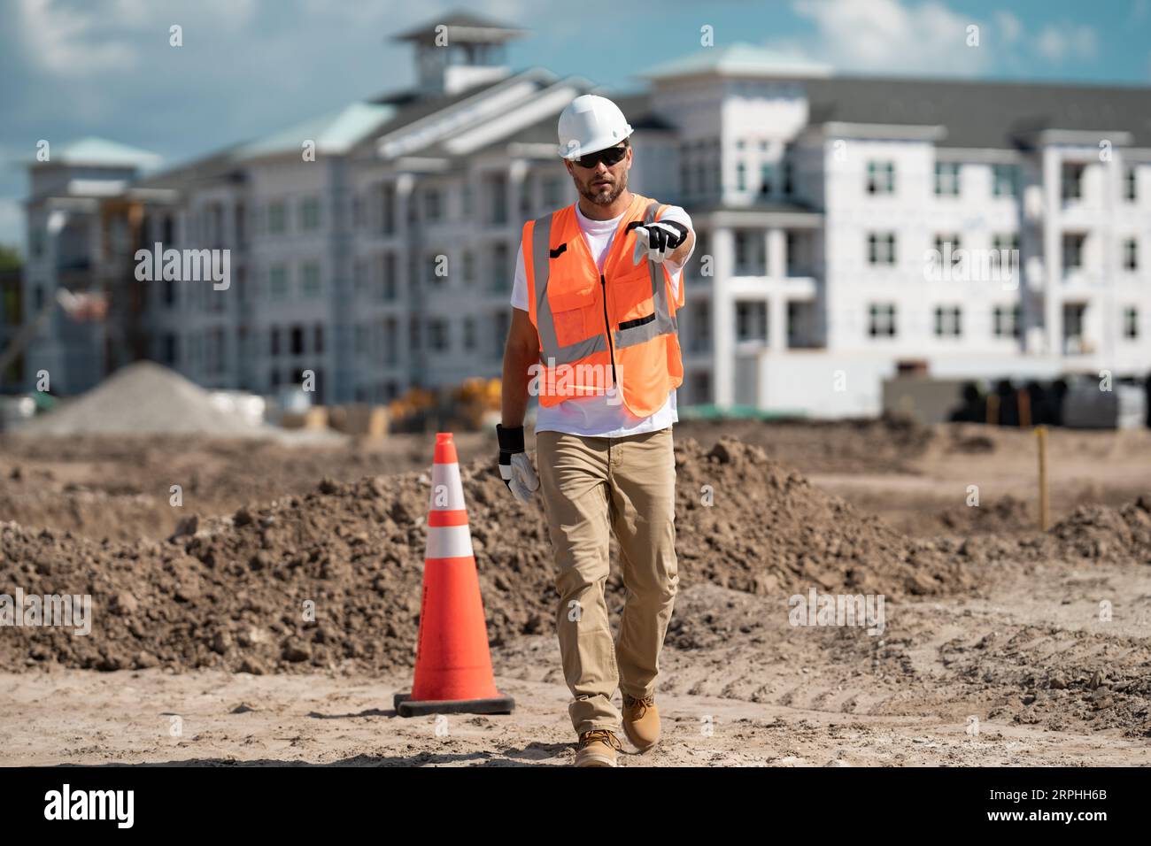 Construction builder in building uniform on buildings construction ...