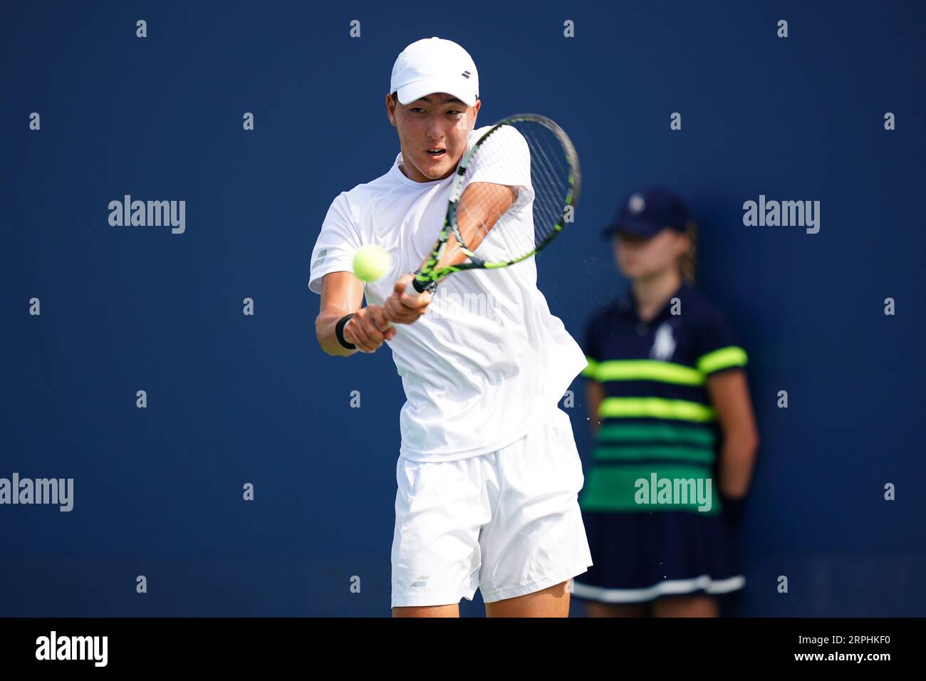 Kyle Kang in action during a junior boys' singles match at the 2023 US ...