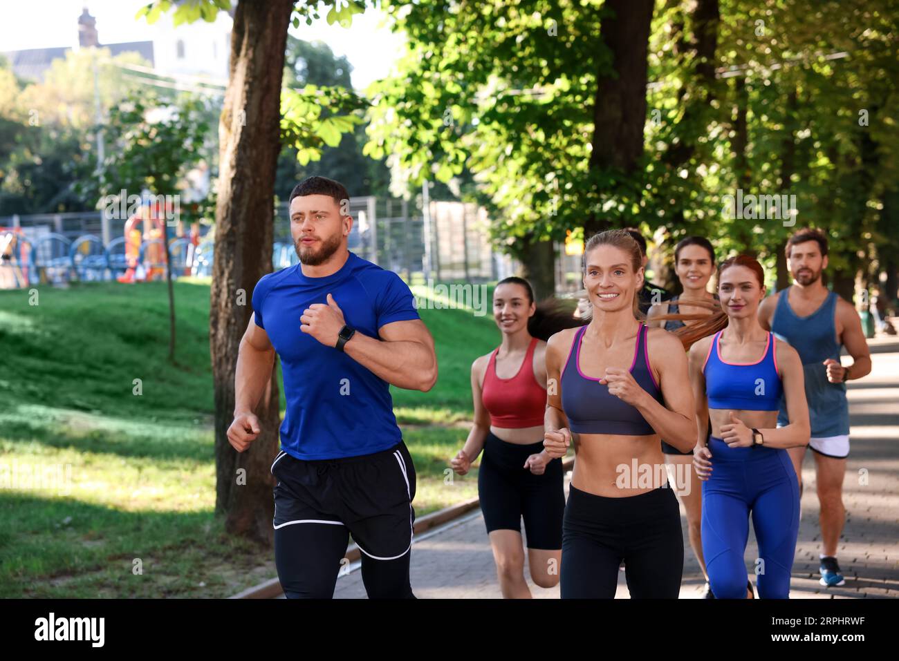 Group of people running in park. Active lifestyle Stock Photo - Alamy