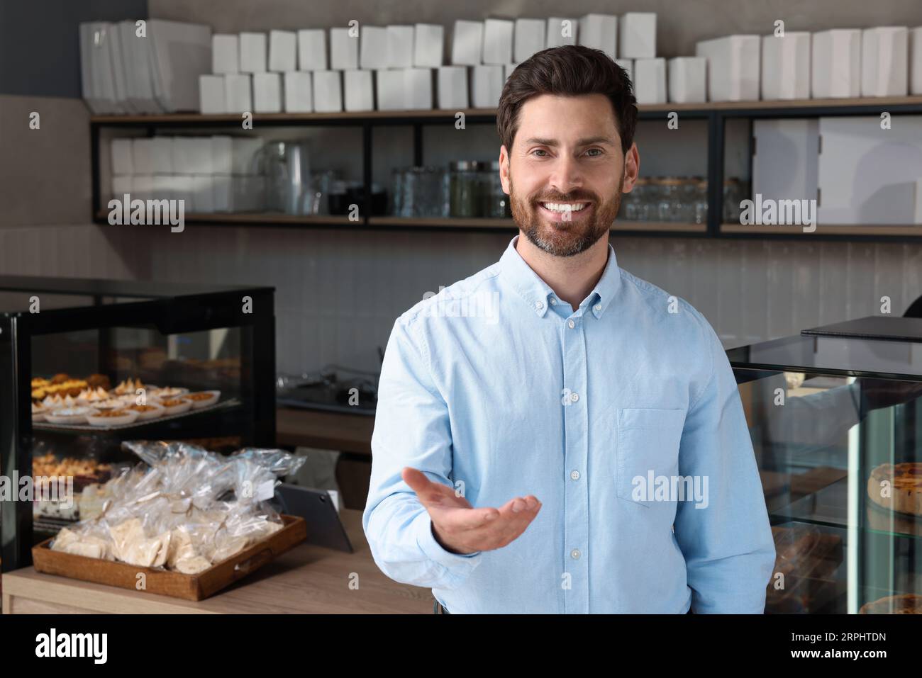 Portrait of happy business owner in bakery shop Stock Photo - Alamy