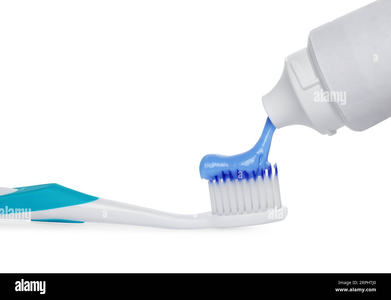 Applying paste on toothbrush against white background Stock Photo - Alamy