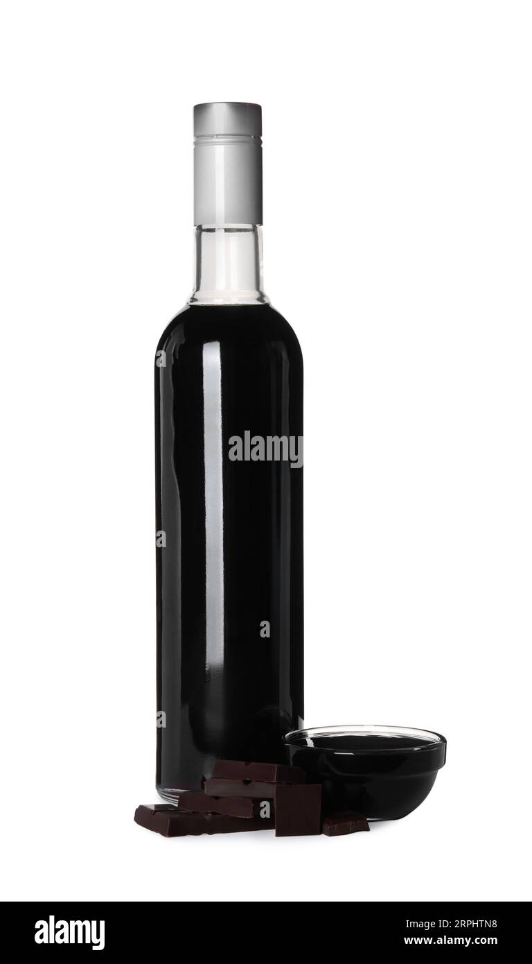 Delicious syrup for coffee and pieces of dark chocolate on white ...