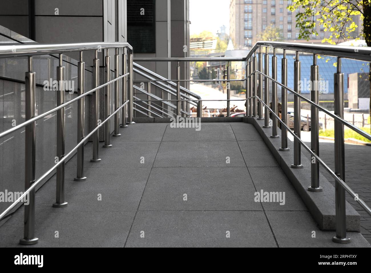 Ramp with metal handrails near building outdoors Stock Photo - Alamy