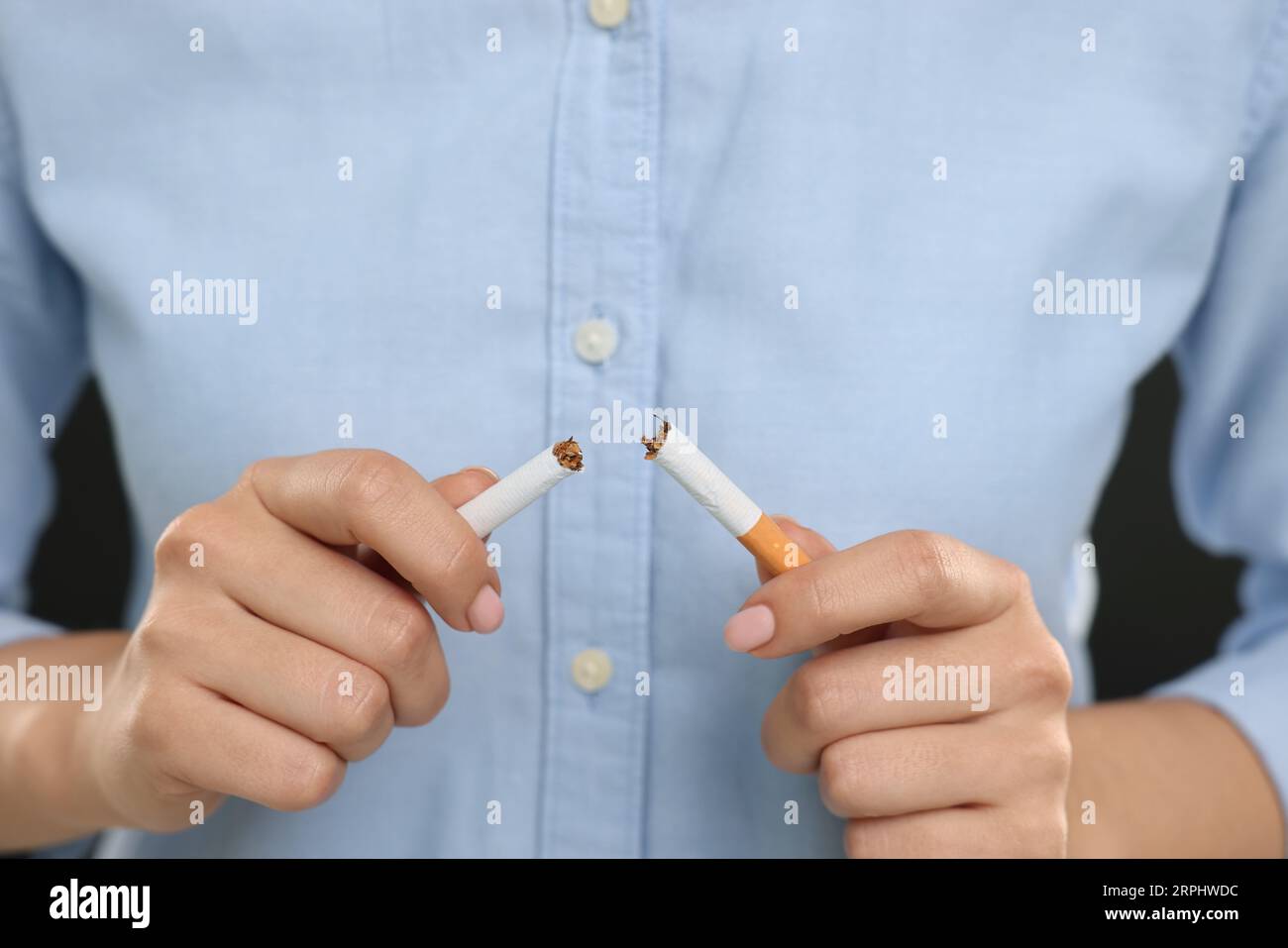 Stop smoking concept. Woman breaking cigarette, closeup Stock Photo - Alamy