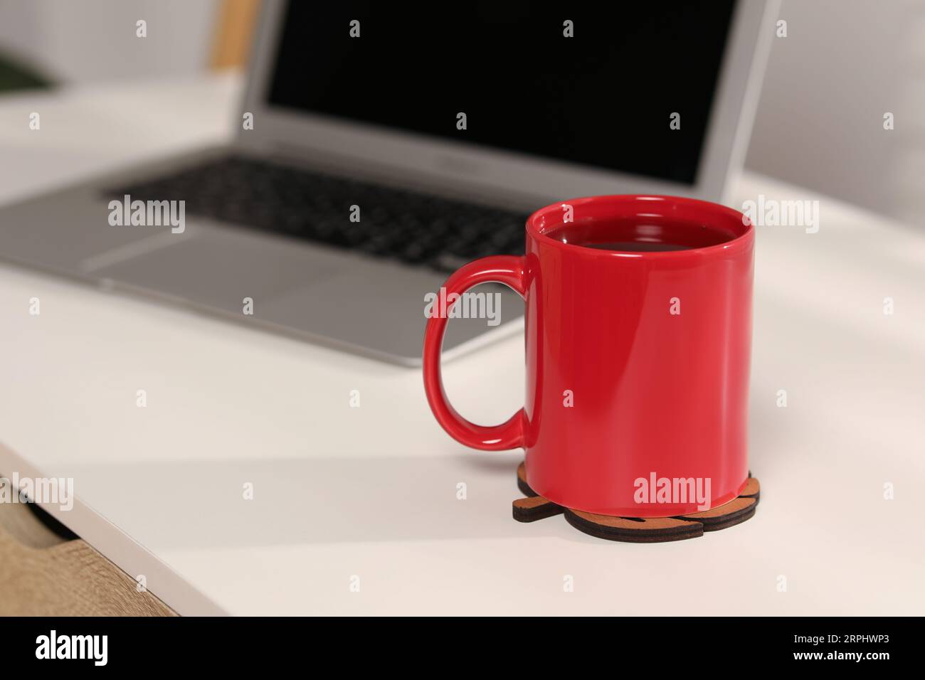Red ceramic mug on table at workplace, space for text Stock Photo - Alamy