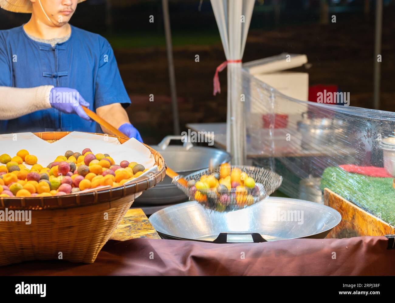 Cooking Sweet potato ball deep fried in hot pan, made from sweet ...