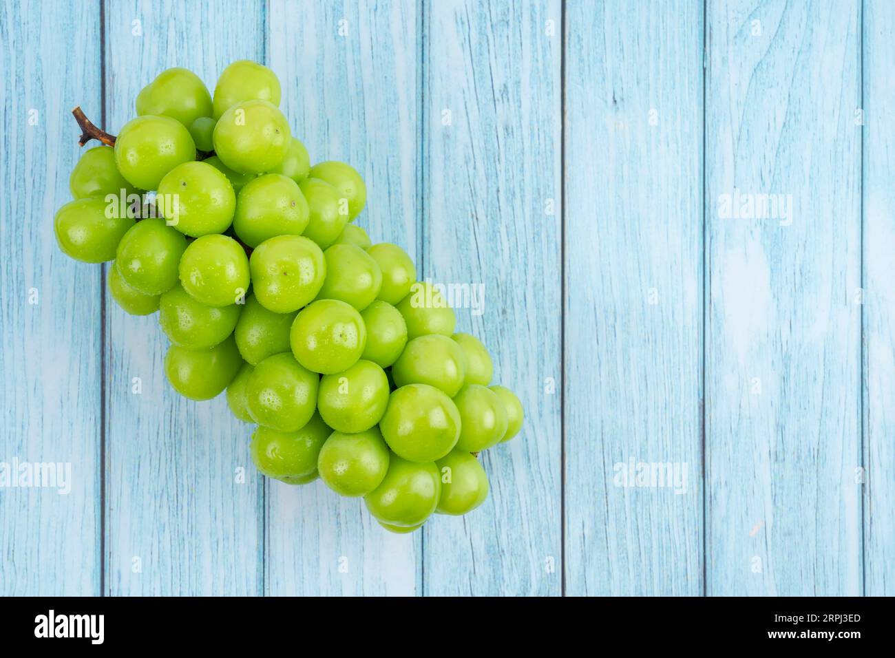 Freshness Japanese Shine Muscat Grape on wooden blue background Stock ...