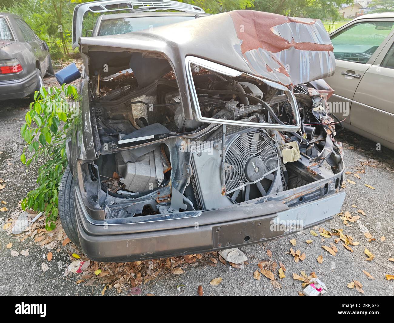 unrecognizable and wrecked cars beyond repair left at the isolated junk ...