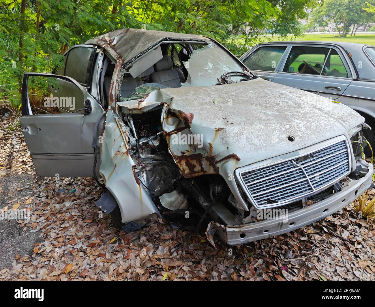 unrecognizable and wrecked cars beyond repair left at the isolated junk ...