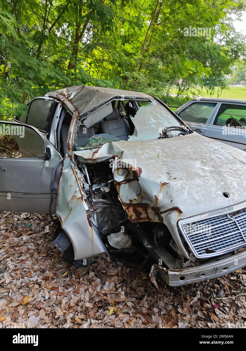 unrecognizable and wrecked cars beyond repair left at the isolated junk ...