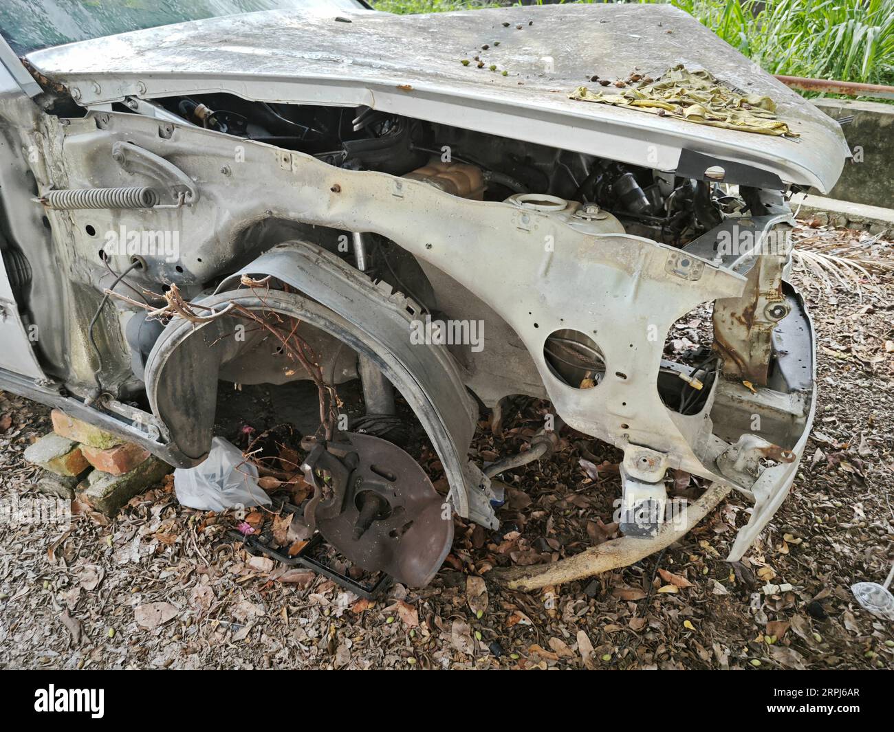 unrecognizable and wrecked cars beyond repair left at the isolated junk ...