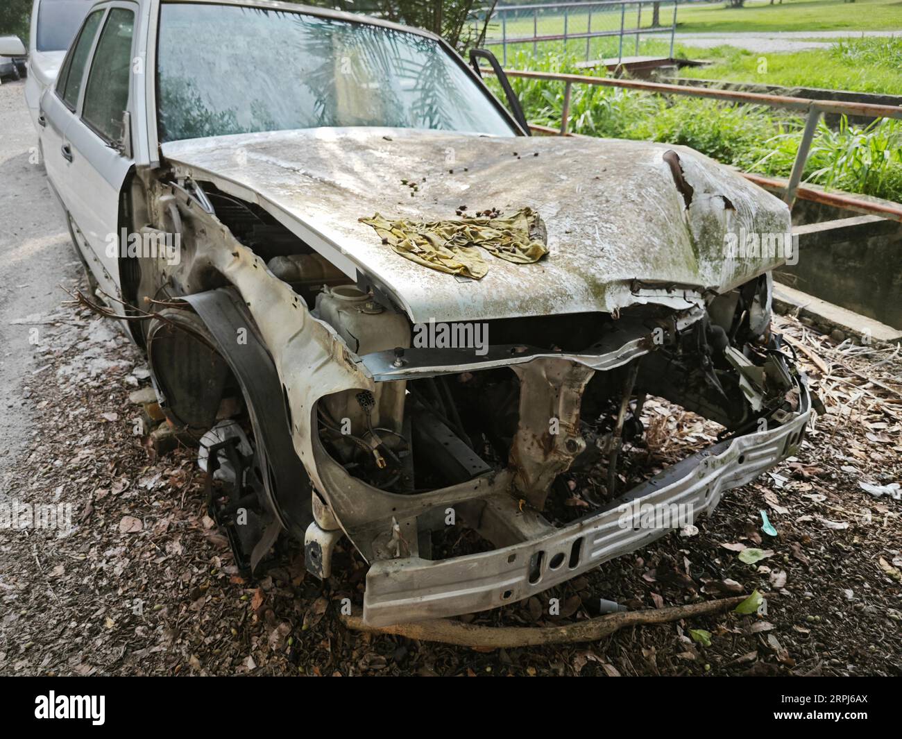 unrecognizable and wrecked cars beyond repair left at the isolated junk ...
