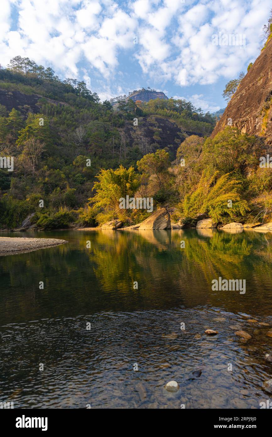 The emerald green water of the Nine Bend River or Jiuxi river through ...