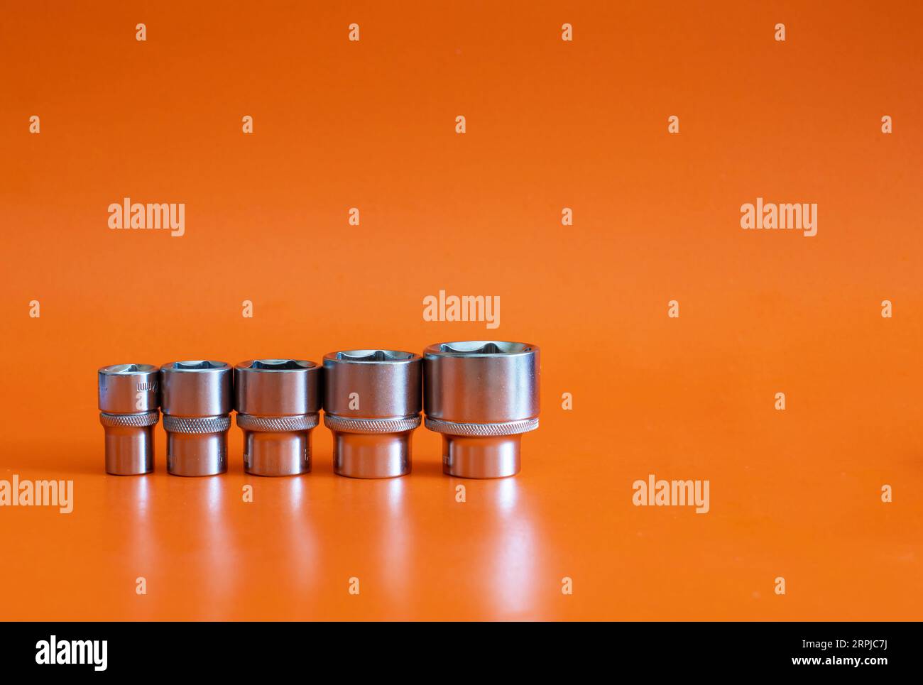Set of wrenches, locks and ratchet wrenches on orange background. set ...