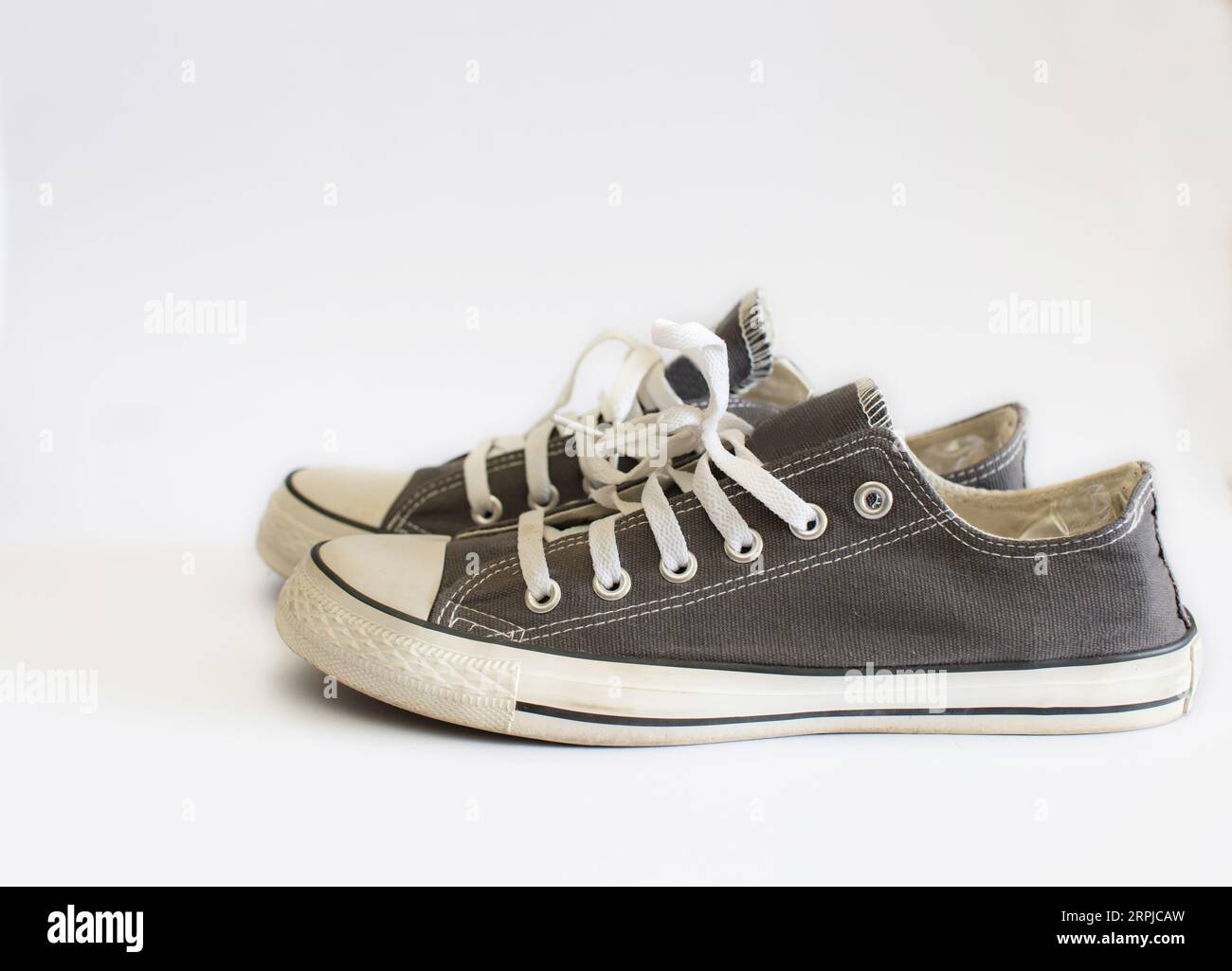 gray sneakers isolated on white background Stock Photo - Alamy