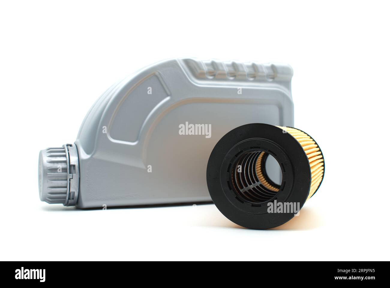 Vehicle engine oil filters elements and motor oil can isolated on a ...