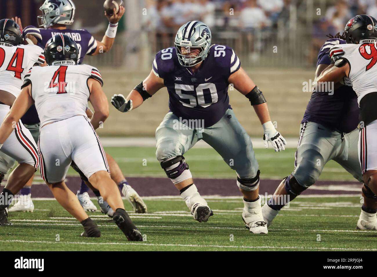 MANHATTAN, KS - SEPTEMBER 02: Kansas State Wildcats offensive lineman Cooper Beebe (50) looks to ...