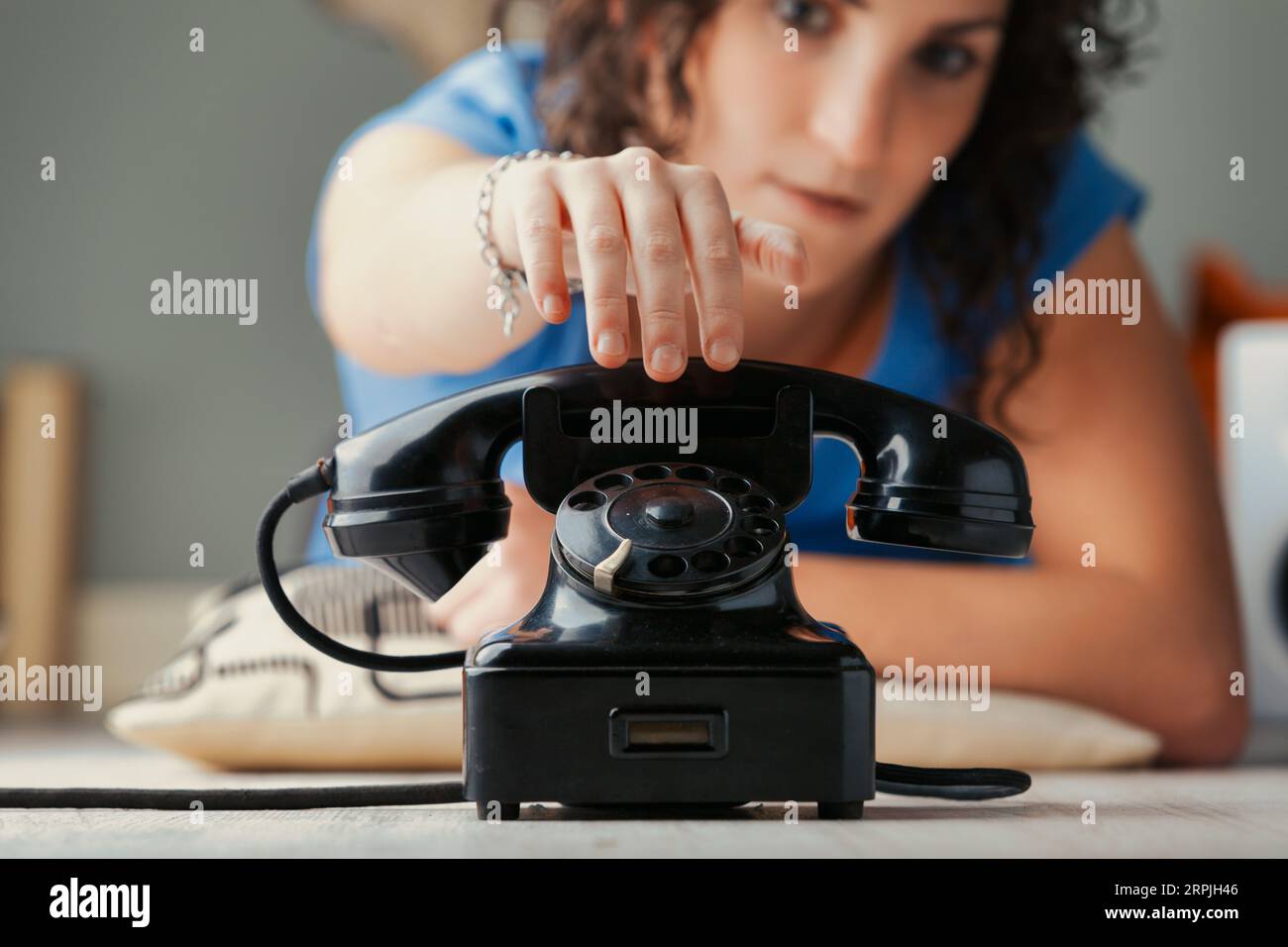 prominent black vintage rotary phone in focus epitomizes the direct ...