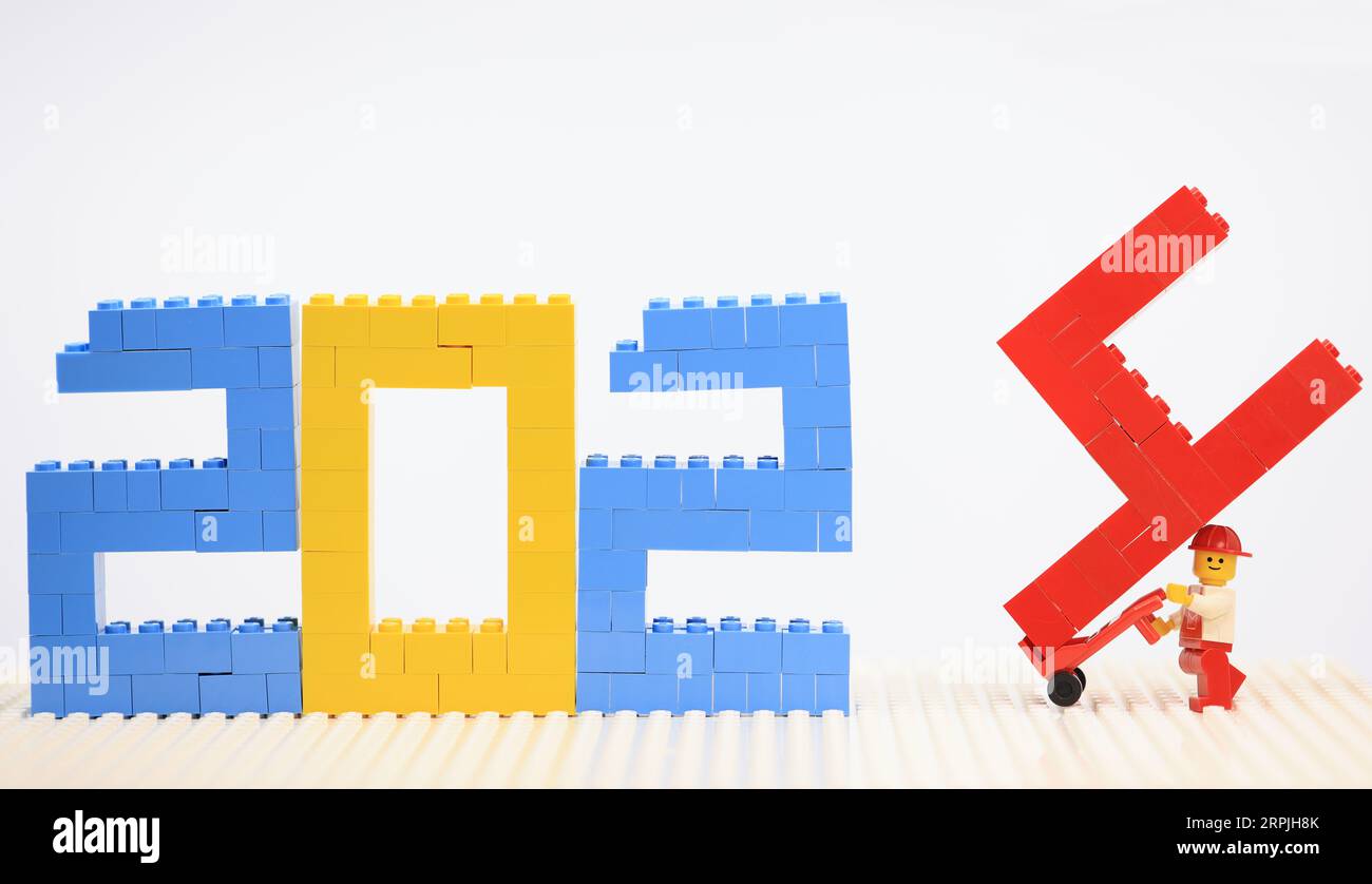 workers set up the new year 2024 wording Stock Photo - Alamy