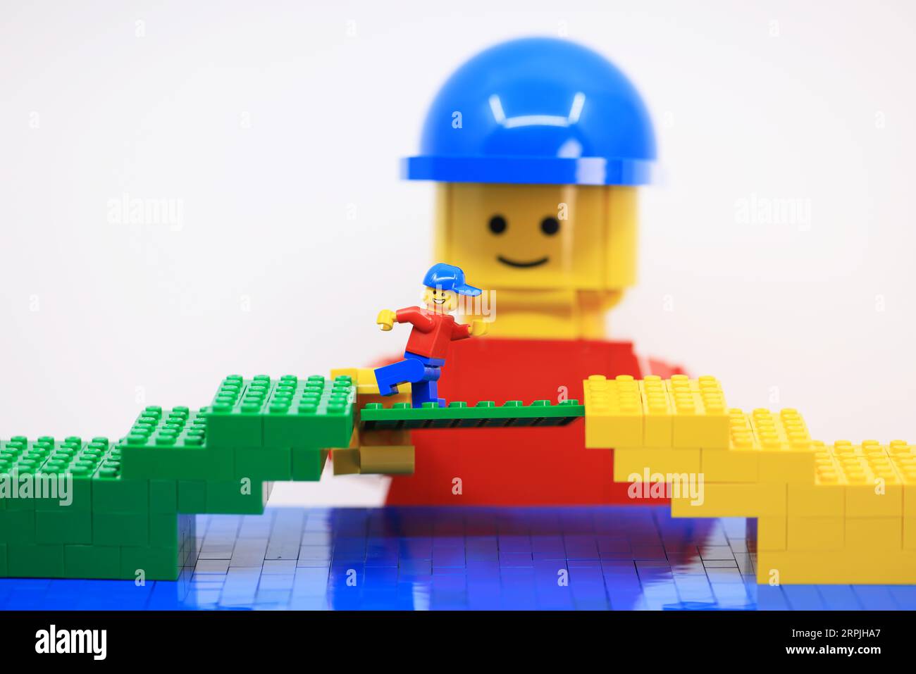 the giant help the people to cross the bridge Stock Photo - Alamy