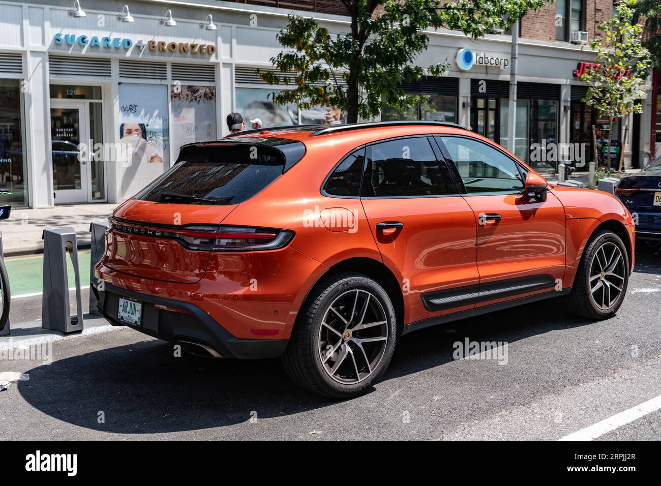 New York City, USA - August 05, 2023: 2023 Porsche Macan T SUV Ruby red ...
