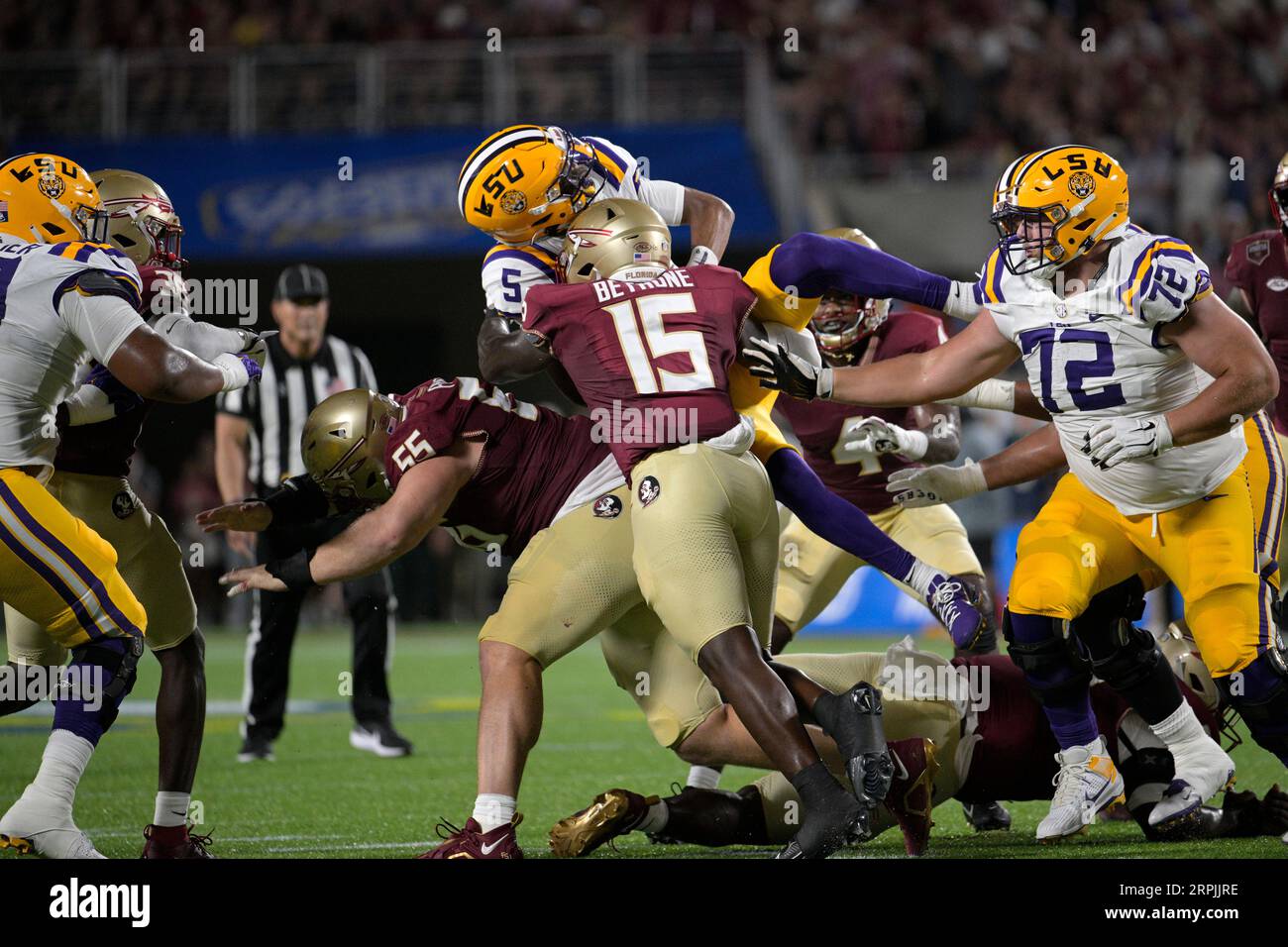 LSU quarterback Jayden Daniels (5) is hit by Florida State linebacker ...