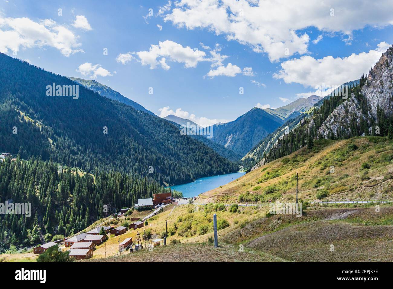 Lower Kolsay mountain lake with tourist infrastructure around in the ...