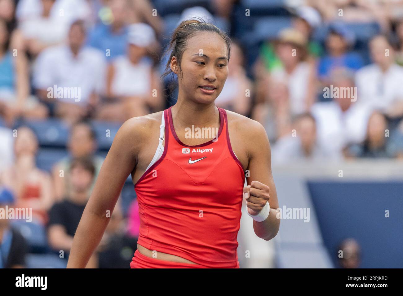 Qinwen Zheng of China reacts during 4th round against Ons Jabeur of Tunisia at the US Open ...