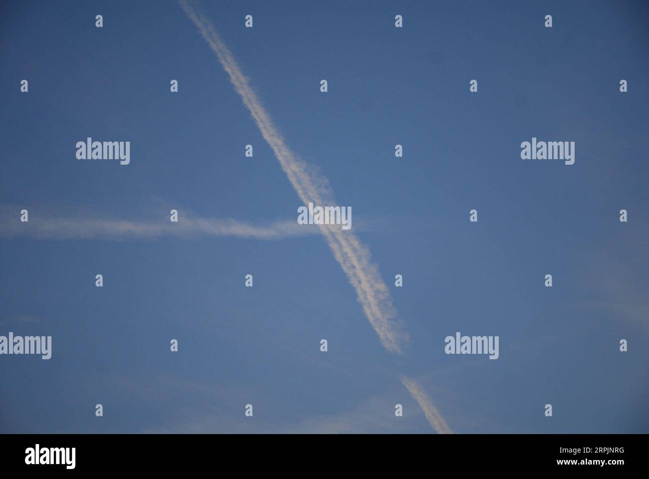 Kastrup/Copenhagen/Denmark/05 September 2023/. White smoke lines sky ...