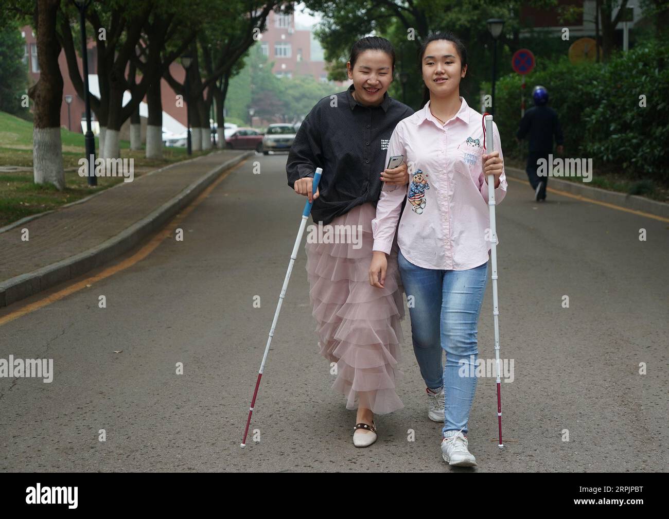 191217 -- BEIJING, Dec. 17, 2019 -- Wu Yifan L and Zhou Wenqing walk along the campus of Nanjing ...