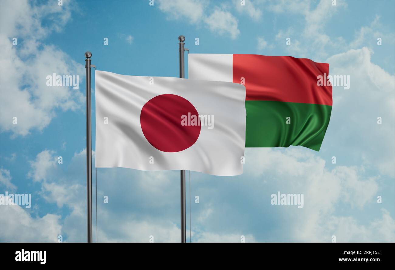 Madagascar flag and Japan flag waving together on blue sky, two country ...