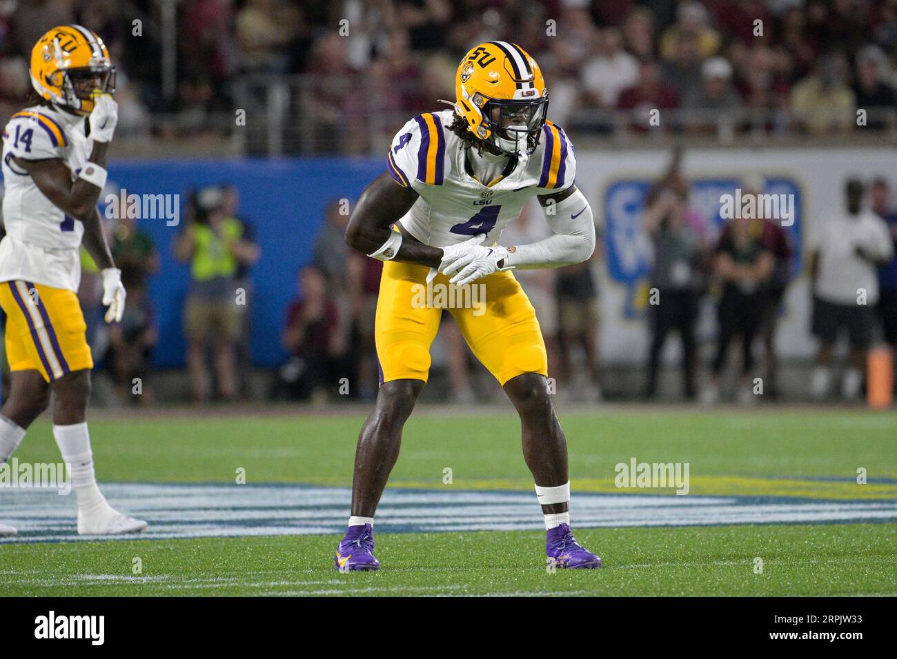 LSU linebacker Harold Perkins Jr. (4) sets up for a play against ...