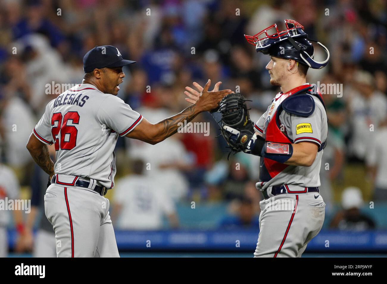Atlanta Braves relief pitcher Raisel Iglesias (26) celebrates a save ...