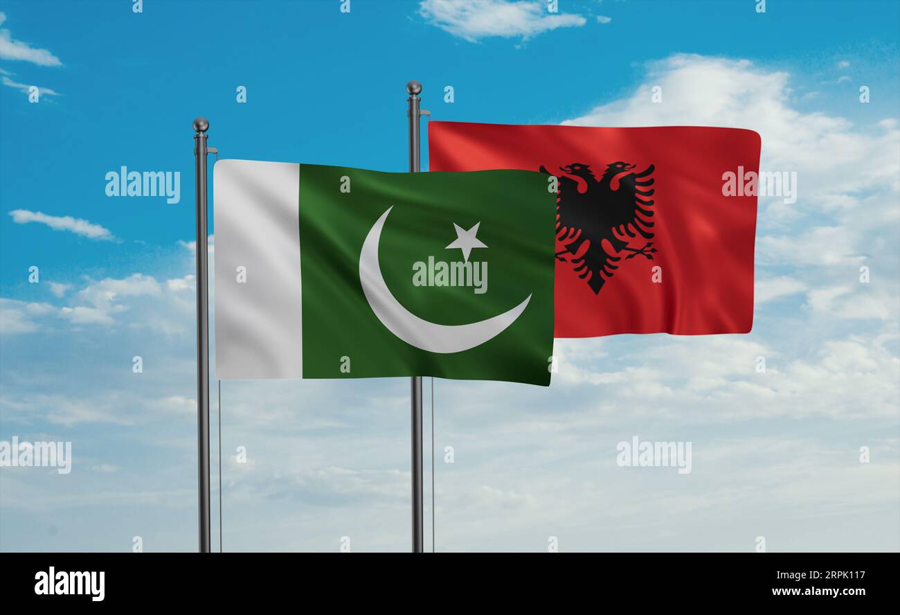 Pakistan flag and Albania flag waving together in the wind on blue sky ...