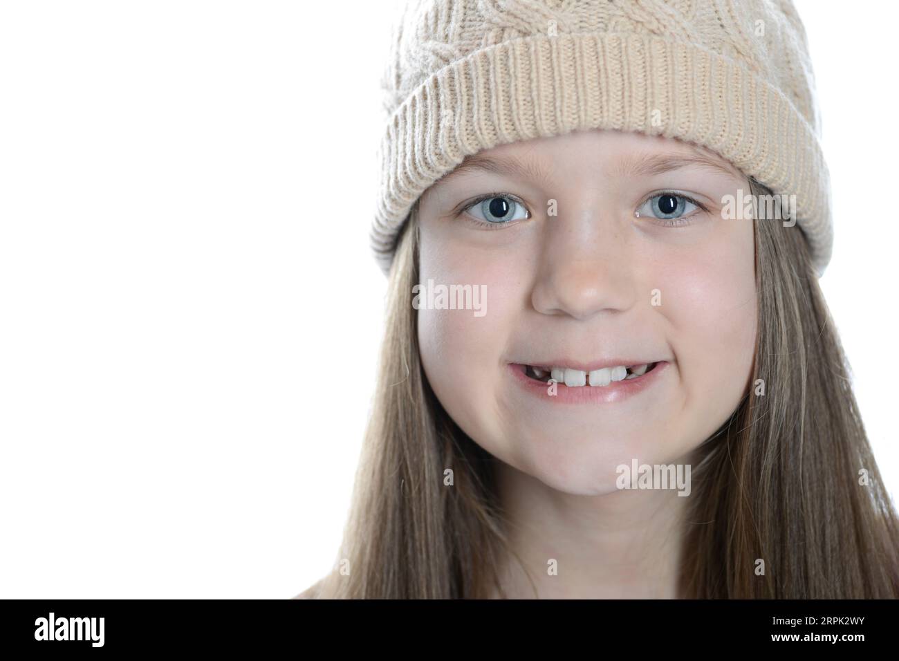 smiling girl in cap with long hairs over white Stock Photo - Alamy