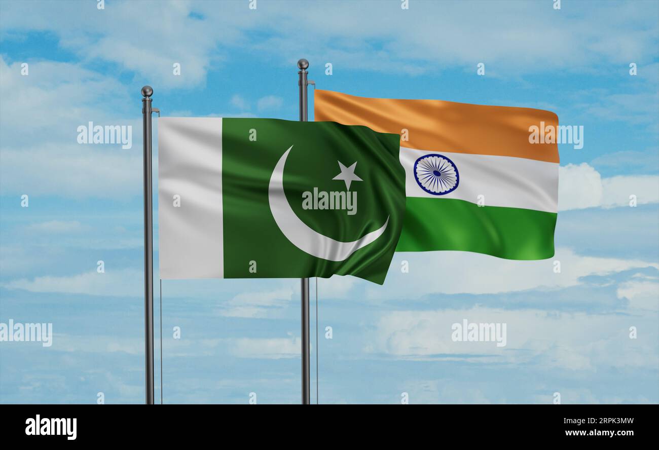 India flag and Pakistan flag waving together on blue sky, two country ...