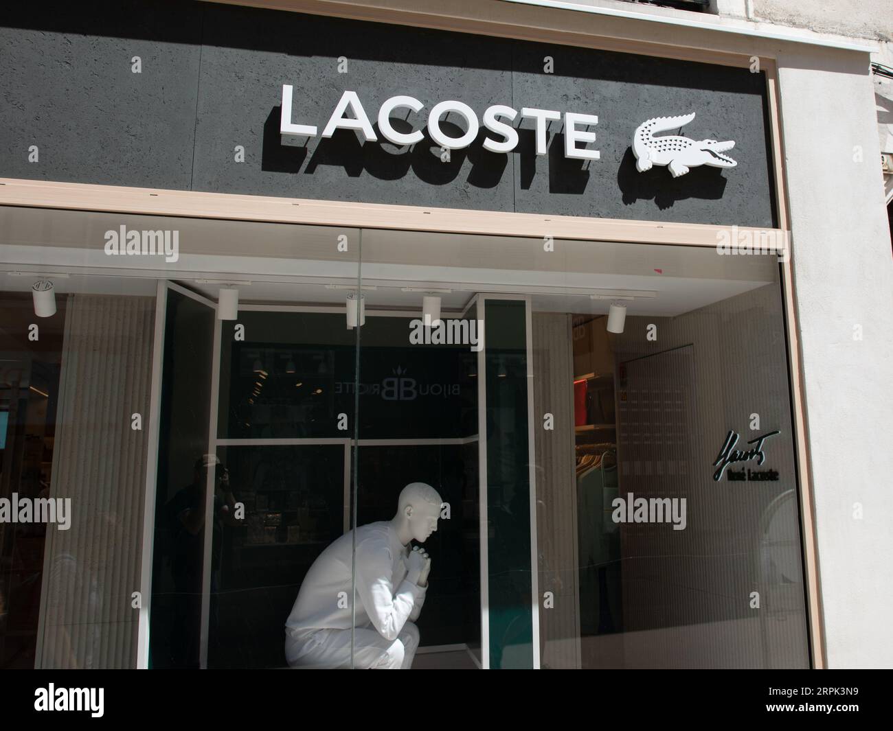 Bordeaux , France - 08 19 2023 : lacoste logo brand and text sign on windows boutique chain ...