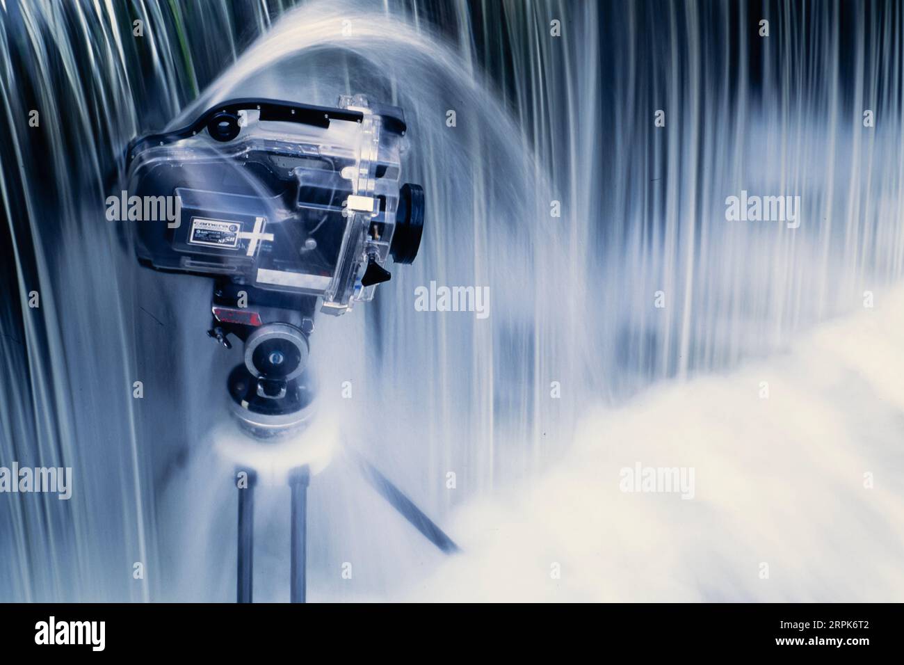 Still life of a film camera in underwater housing placed underneath a ...