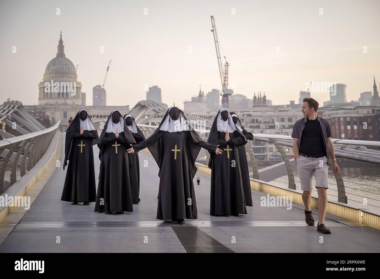 London, UK. 5th September 2023. A bemused local walks past seven ...