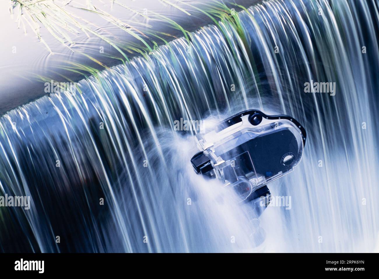 Still life of a film camera in underwater housing placed underneath a ...